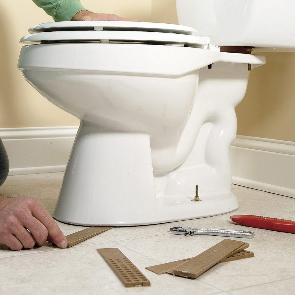 Why Your Toilet Rocks Front to Back (and 3 Easy Fixes) - Toilet Reviewer